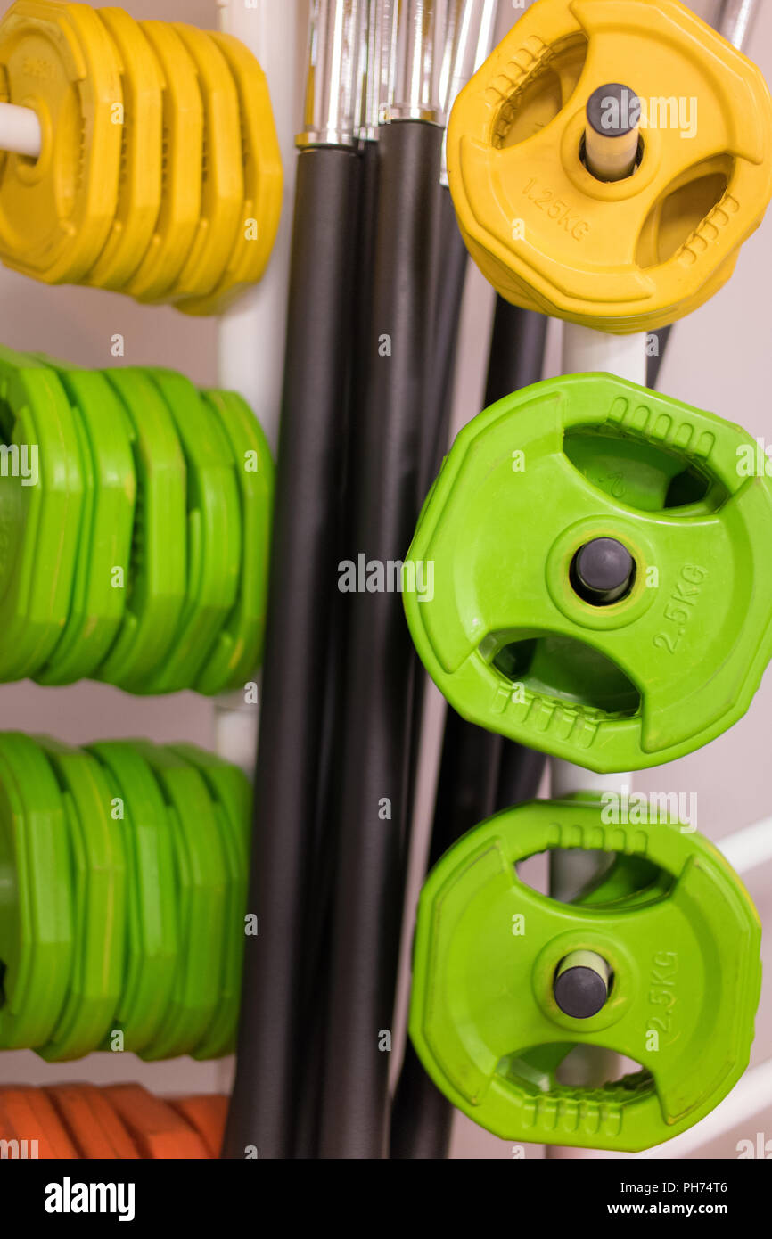Colorful new weights in a gym or shop Stock Photo - Alamy