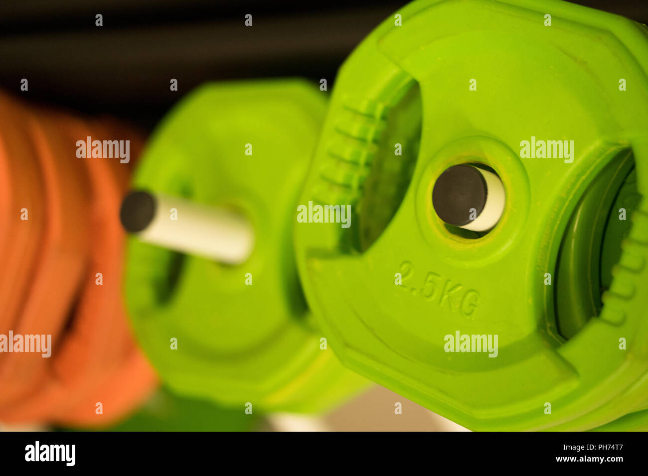 Colorful weights for gym equipment Stock Photo - Alamy