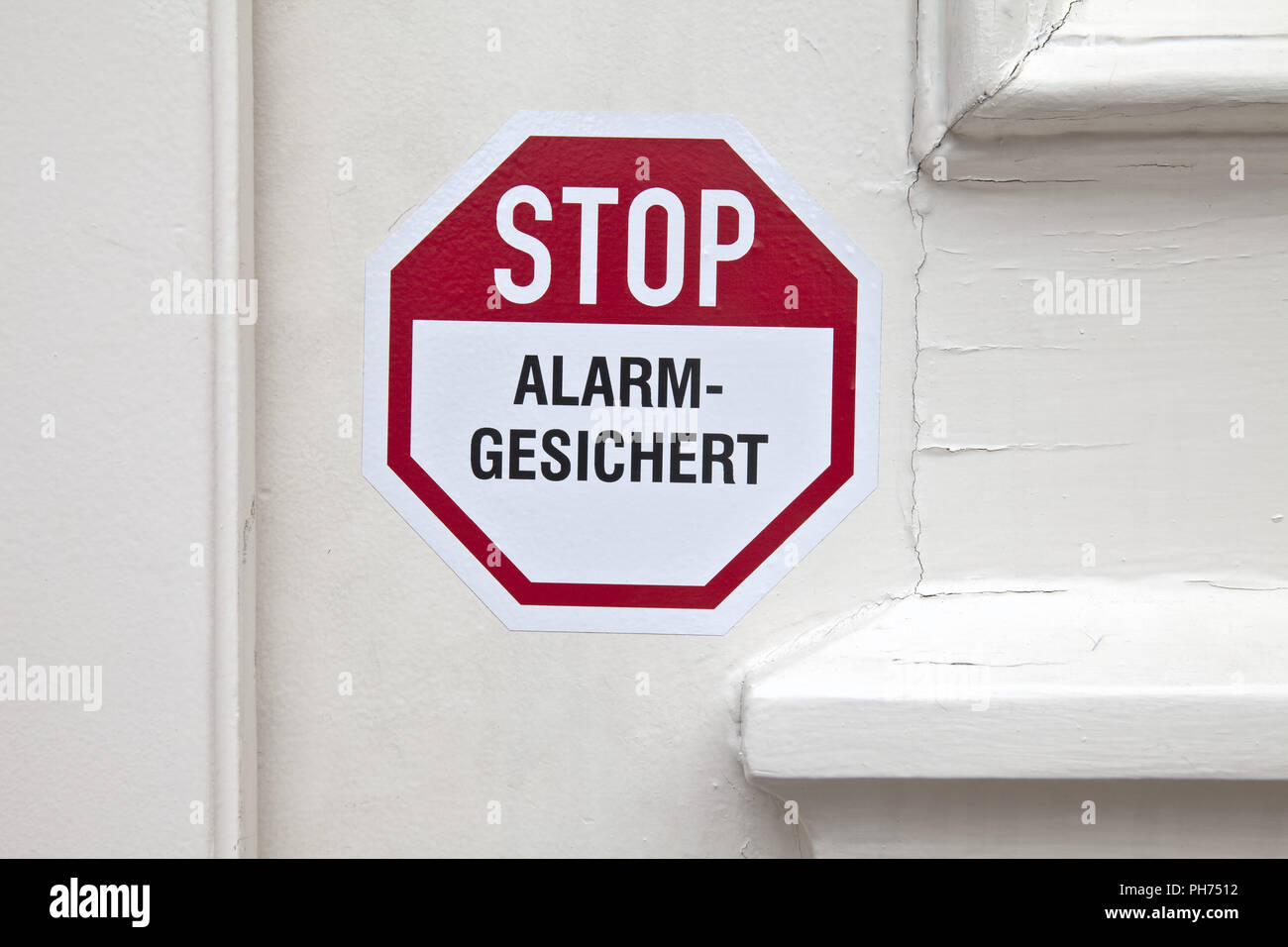 Sticker on the door stop alarm Stock Photo - Alamy