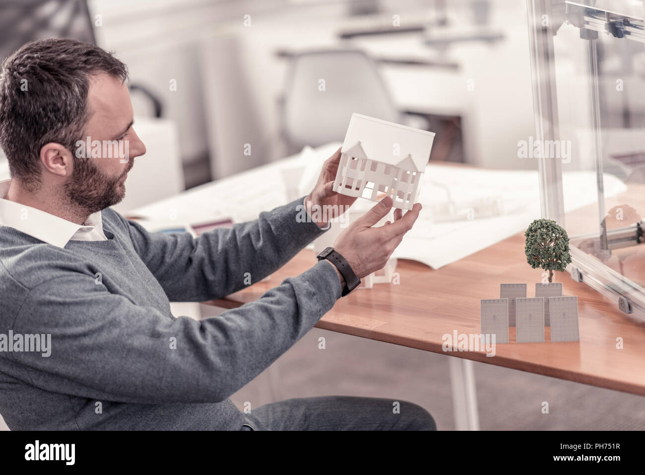 Concentrated man working on landscape design project Stock Photo - Alamy