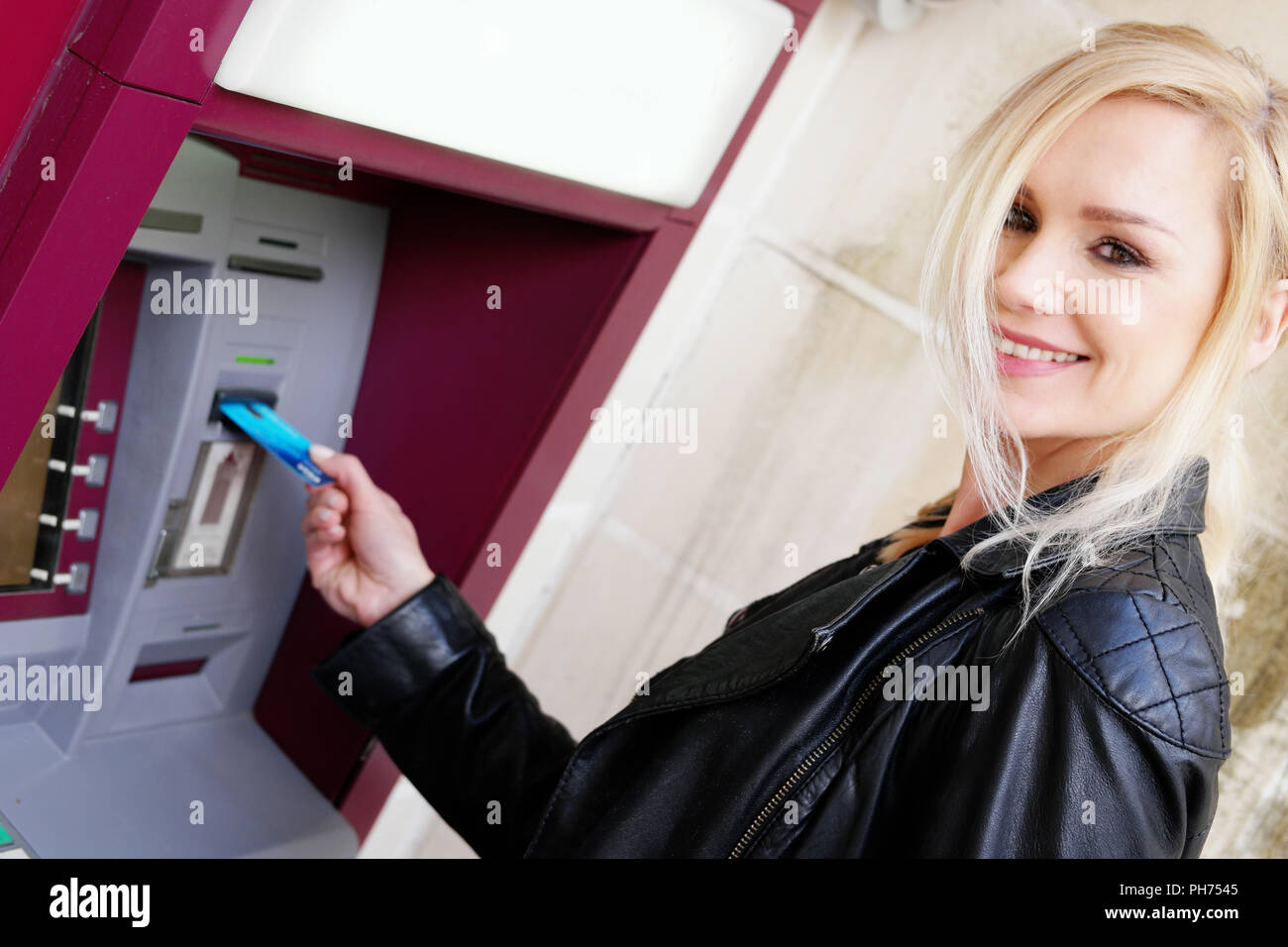 Inserting atm card in slot hi-res stock photography and images - Alamy