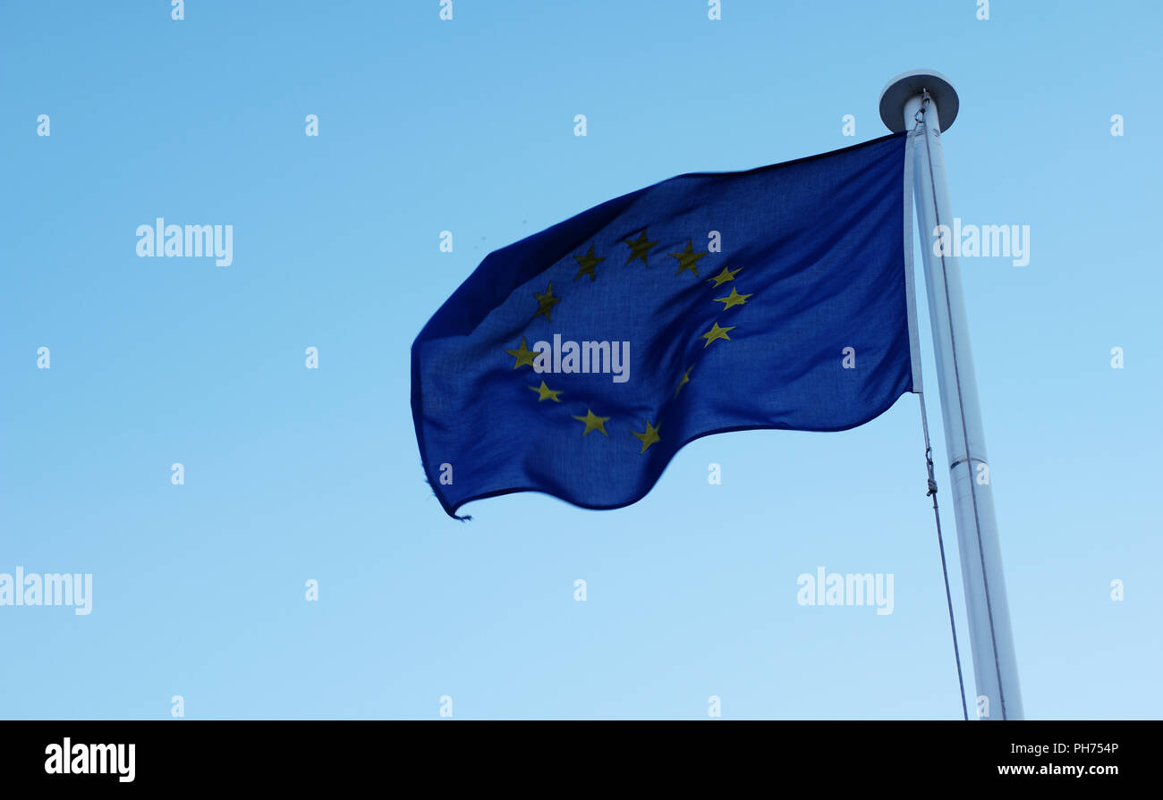 European Union Flag on Light Blue Sky Background Stock Photo - Alamy