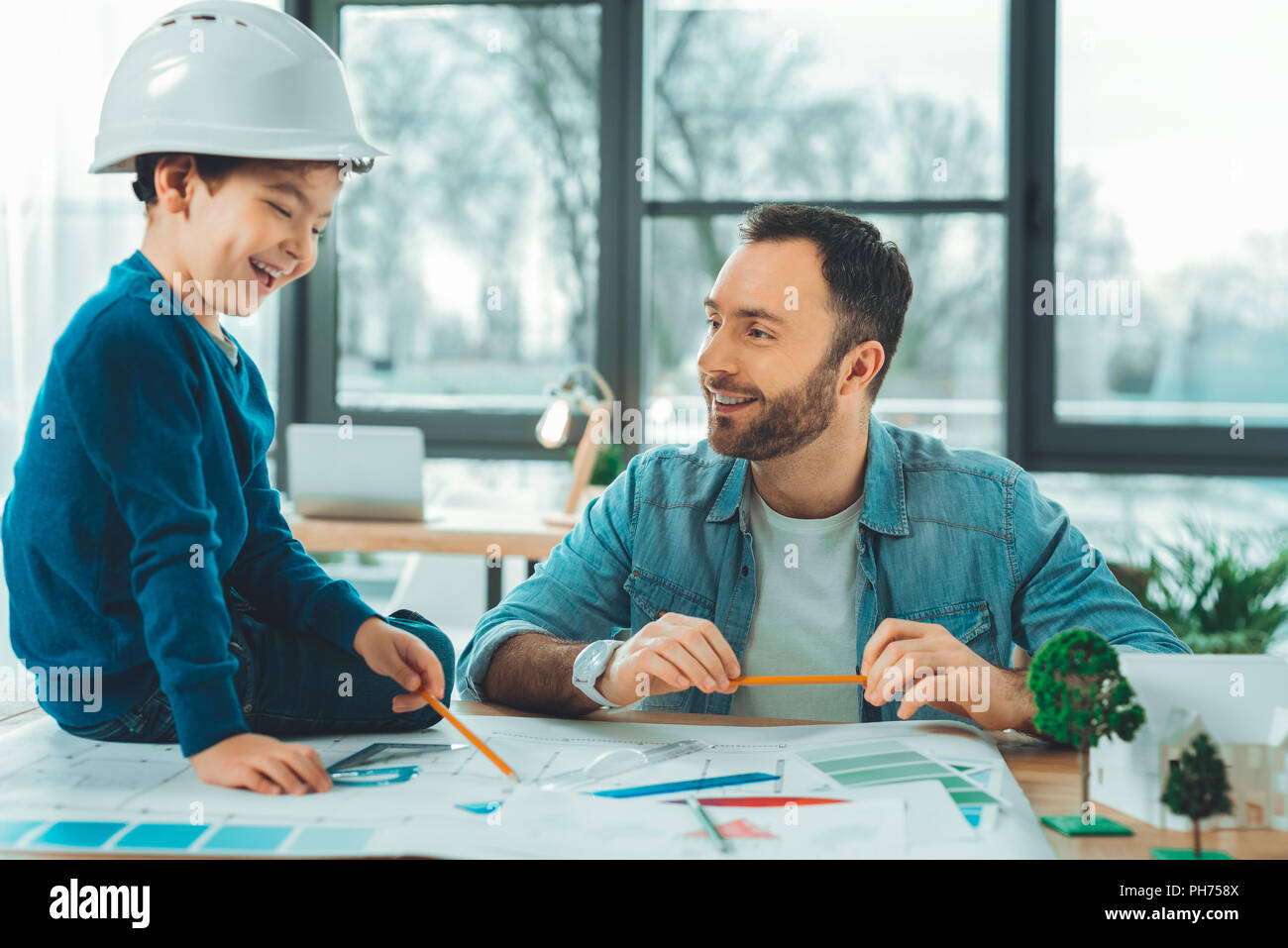 Happy kid spending day with dad at work Stock Photo - Alamy