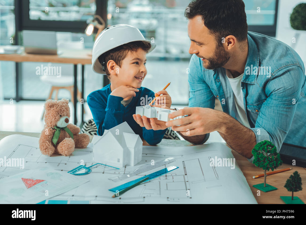 Attentive father listening to his son Stock Photo - Alamy