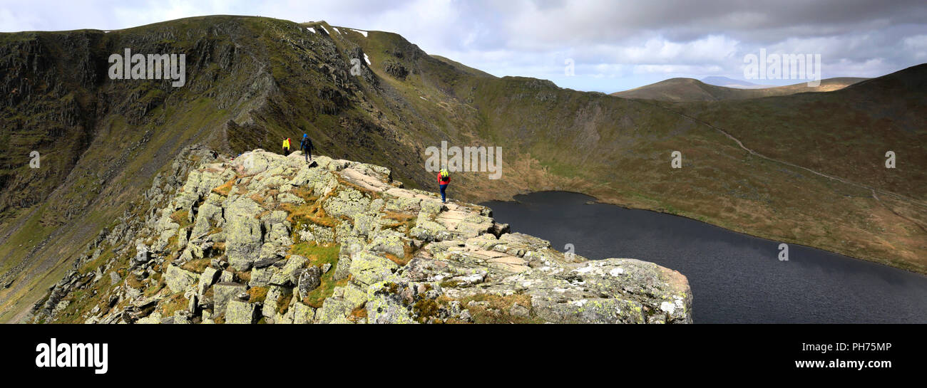 Walkers on Striding Edge ridge on the way to Helvellyn fell, Lake ...