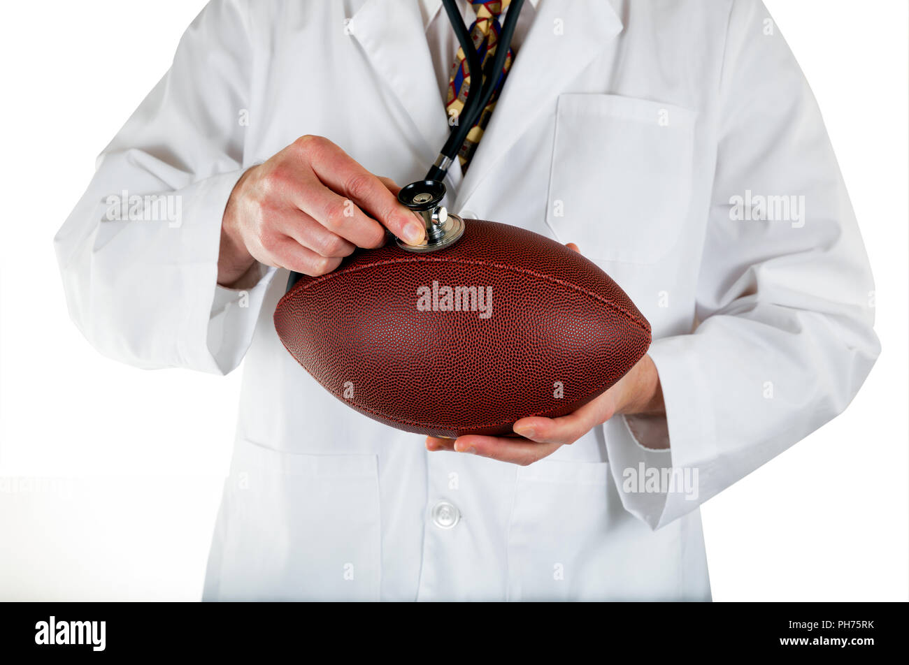 Medical doctor checking health of Football on white background Stock ...