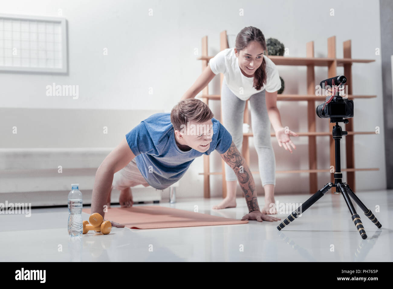Sporty woman giving advices about sport Stock Photo - Alamy