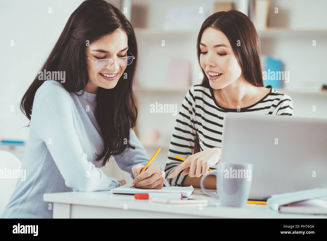 Ethnic college student taking notes hi-res stock photography and images ...