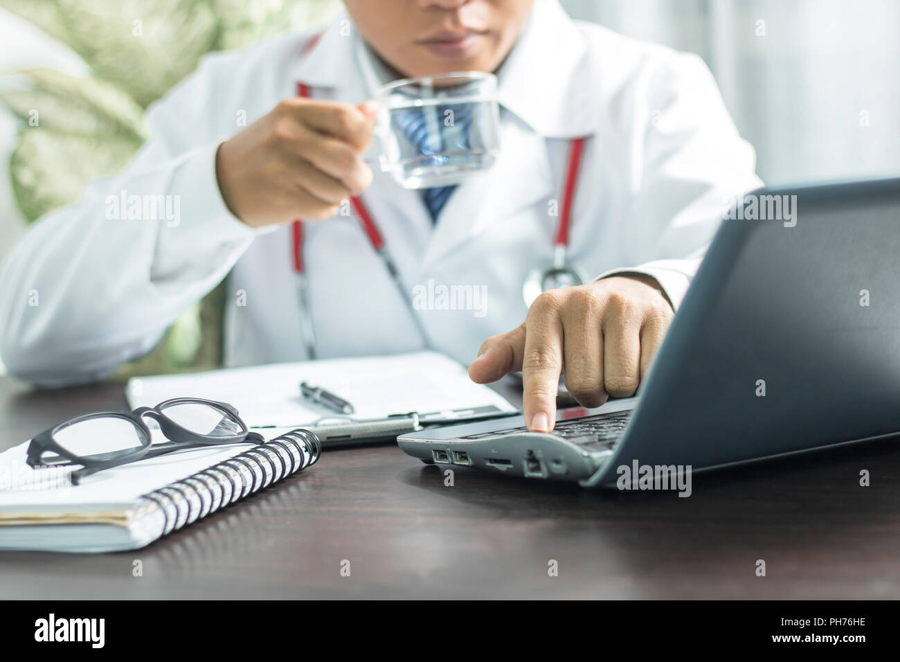 Doctor drinking water hi-res stock photography and images - Alamy