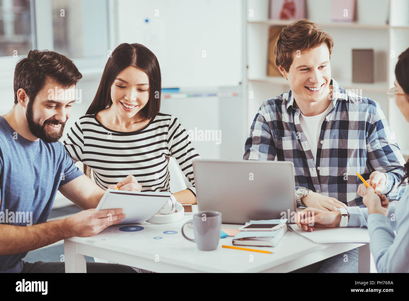 Smart positive people sharing their ideas Stock Photo - Alamy