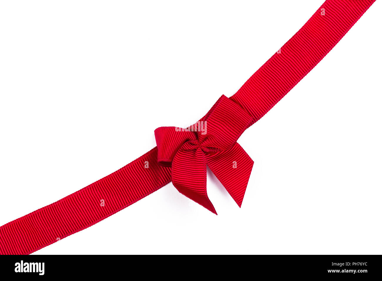 Red ribbon with loop on white background Stock Photo - Alamy