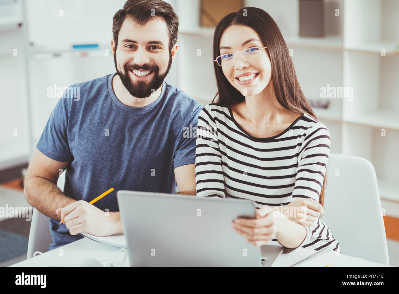 Happy cheerful people looking at you Stock Photo - Alamy