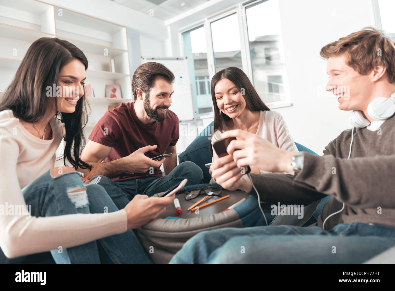 Positive joyful people talking to each other Stock Photo - Alamy
