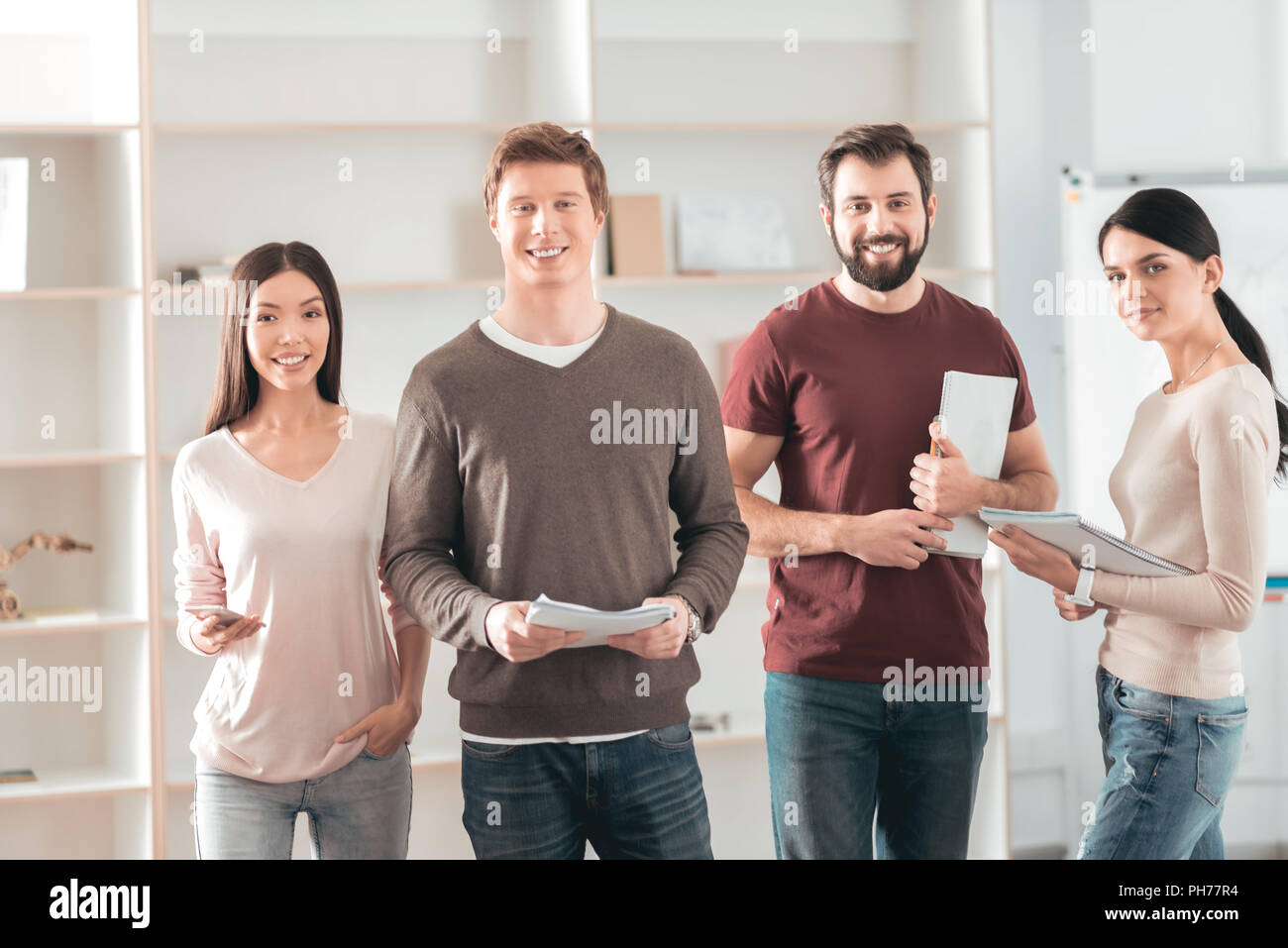 Smart young people looking at you Stock Photo - Alamy