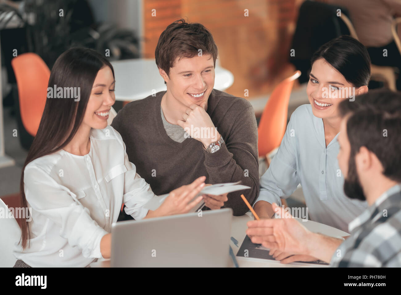 Nice cheerful people enjoying their work Stock Photo - Alamy