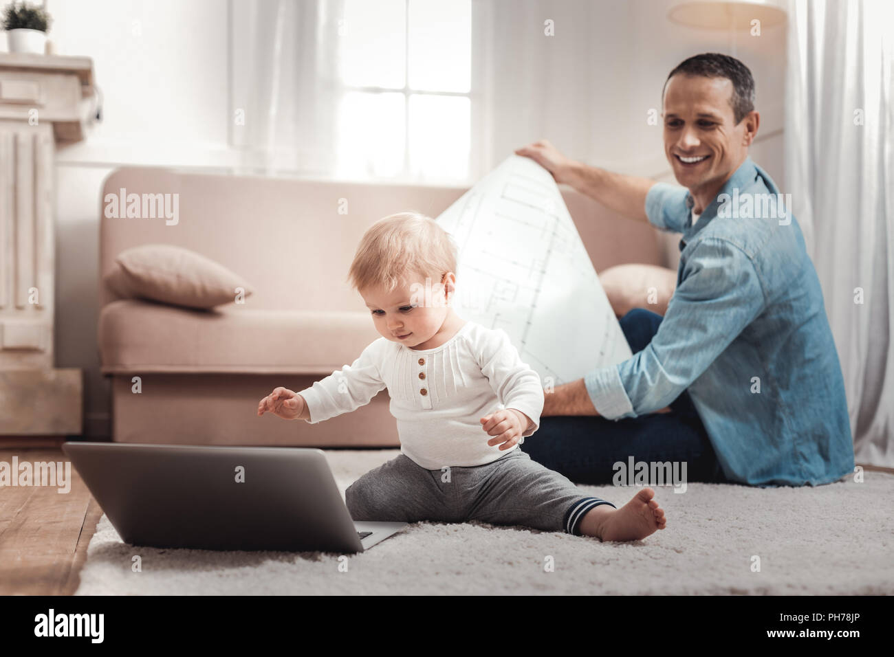 Smart cute baby looking at the laptop screen Stock Photo - Alamy