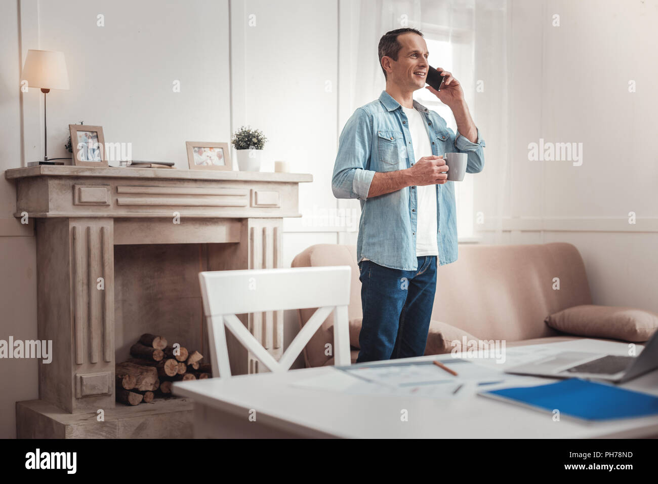 Happy positive man making a phone call Stock Photo - Alamy