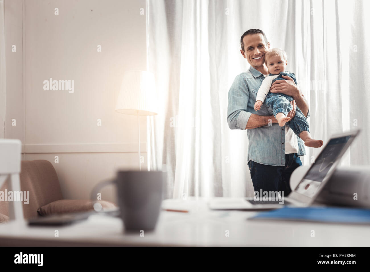 Happy nice man staying at home Stock Photo - Alamy