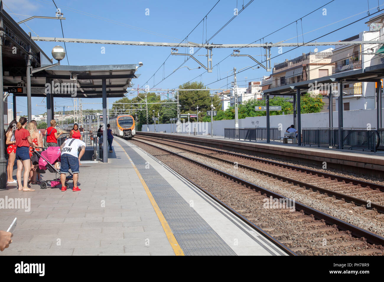 People Wait at Sitges Train Station - Spain Stock Photo - Alamy