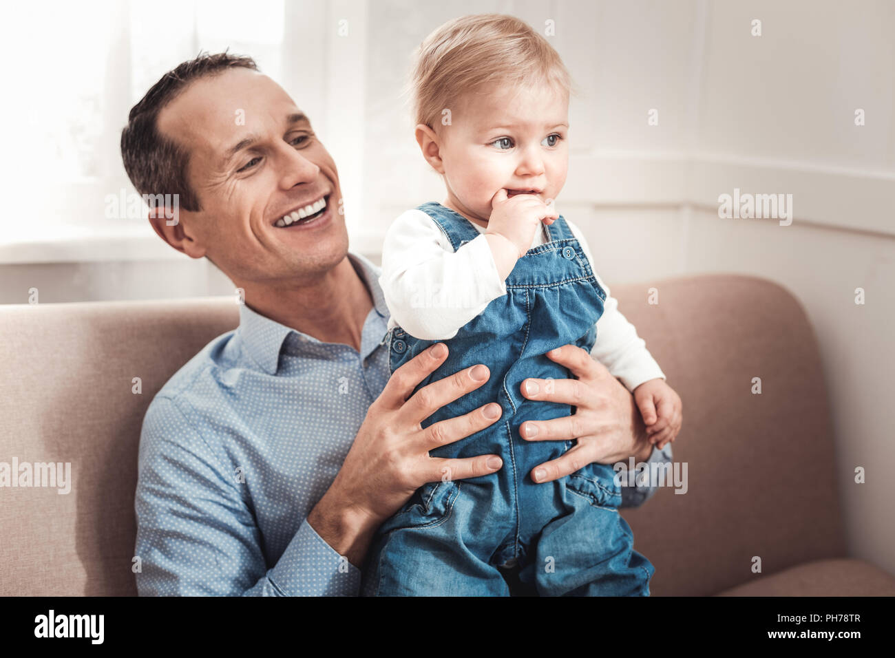 Cute thoughtful child biting his finger Stock Photo - Alamy