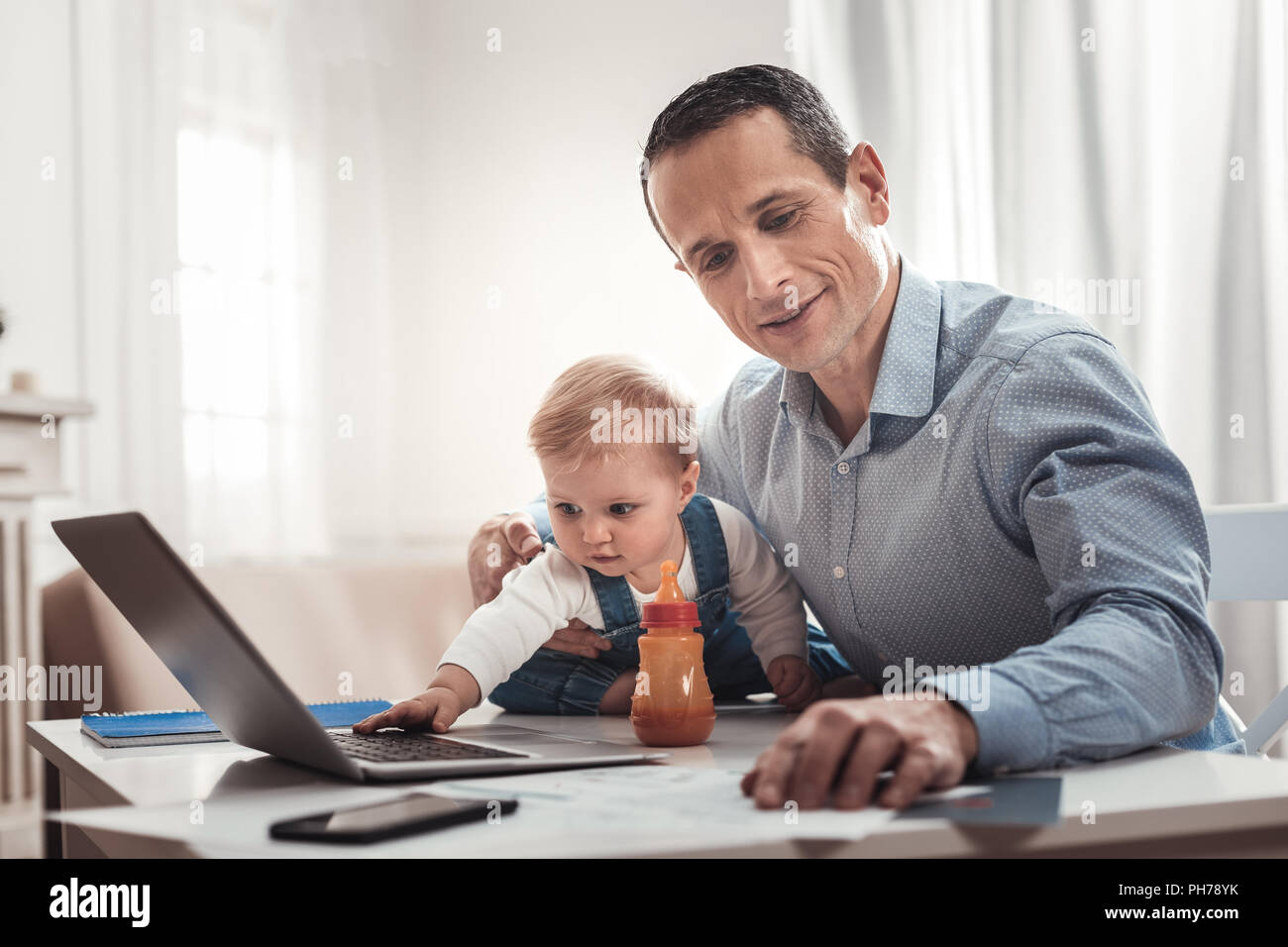 Serious father baby hi-res stock photography and images - Alamy