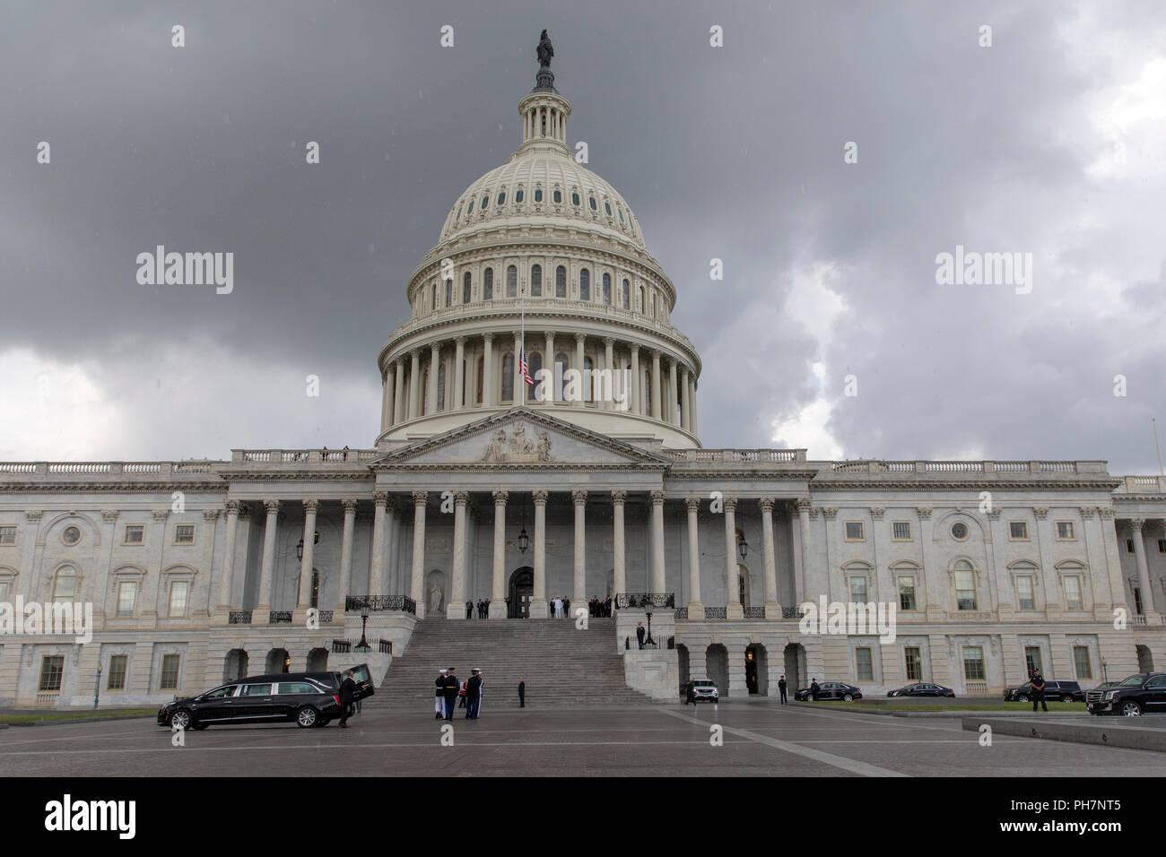 A United States Military Honor Guard carries the casket of former ...