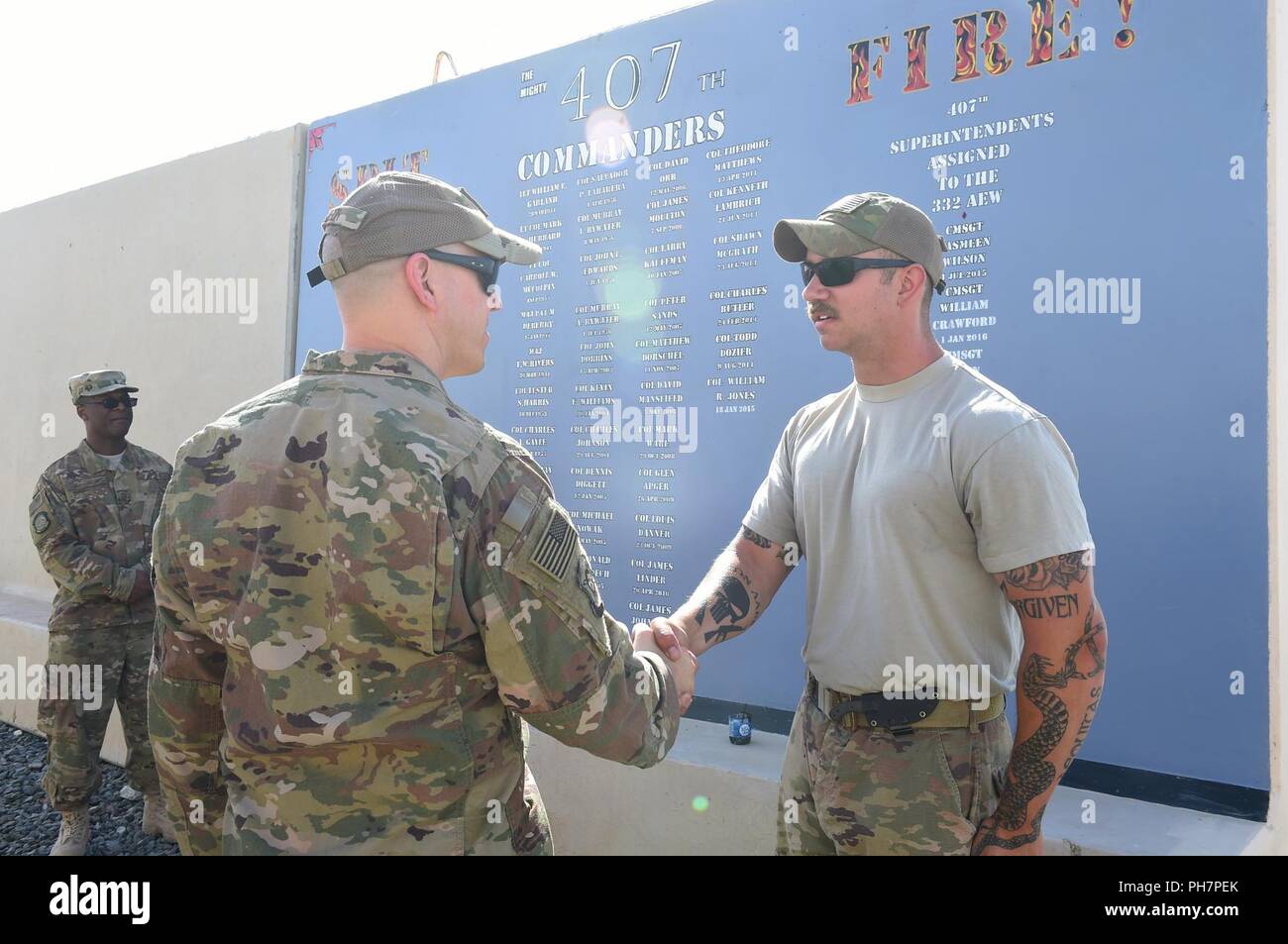 Col. Scott Gibson, 407th Air Expeditionary Group commander, coins ...