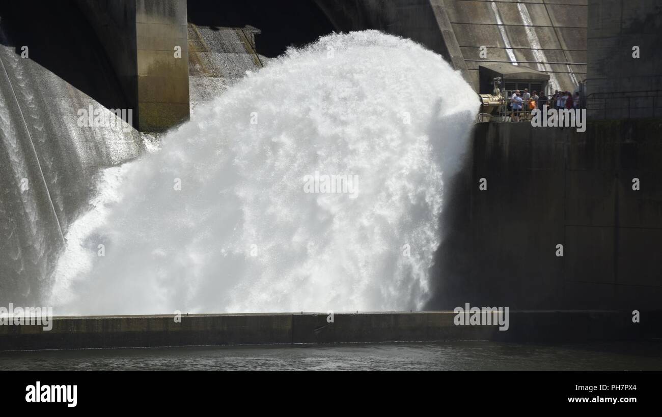 A tour group watches water spray into the tailwater at J. Percy Priest ...
