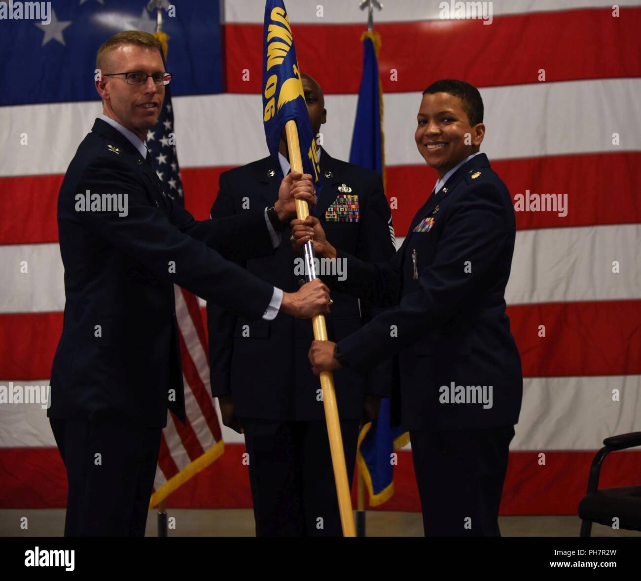 Col. Greg Buckner, 90th Maintenance Group commander, passes the guidon ...