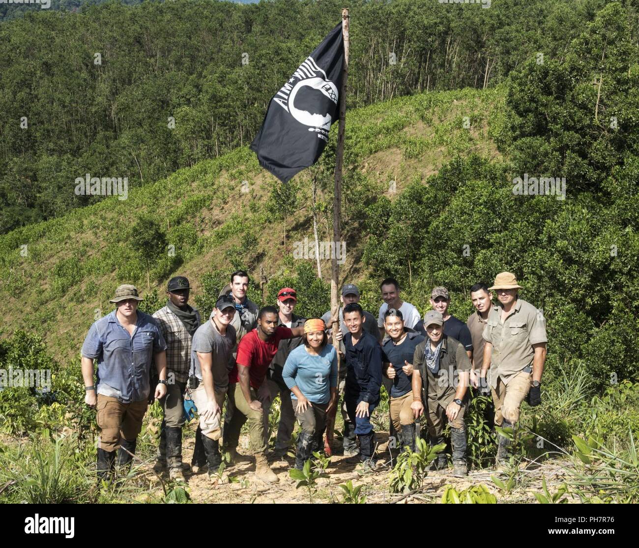 Members of a Defense POW/MIA Accounting Agency (DPAA) recovery team ...