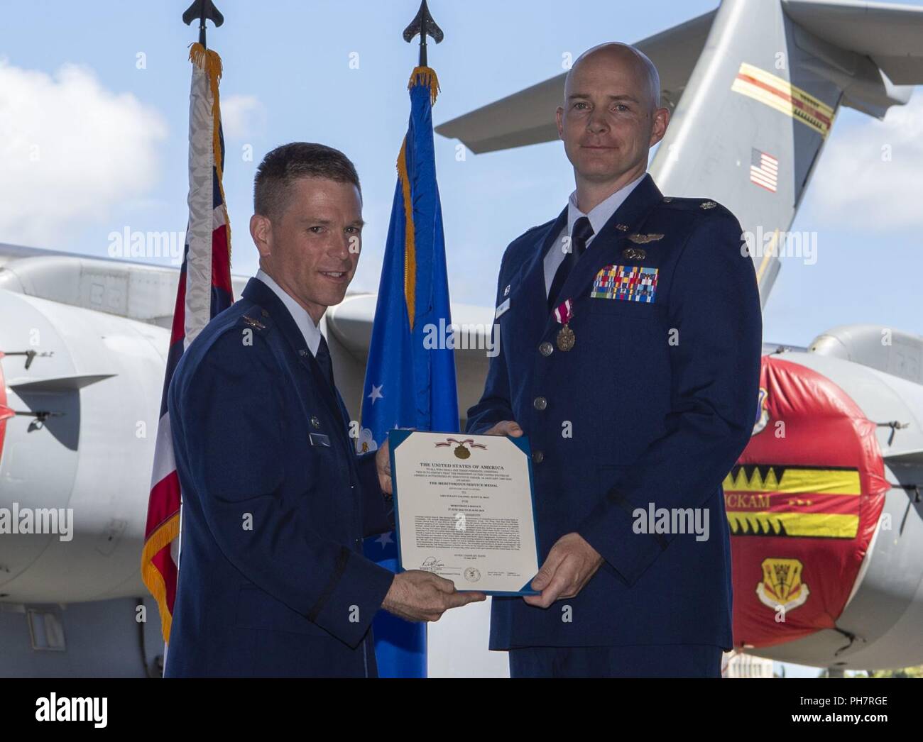 Col. Robert Copes, 15th Maintenance Group commander, presents the ...