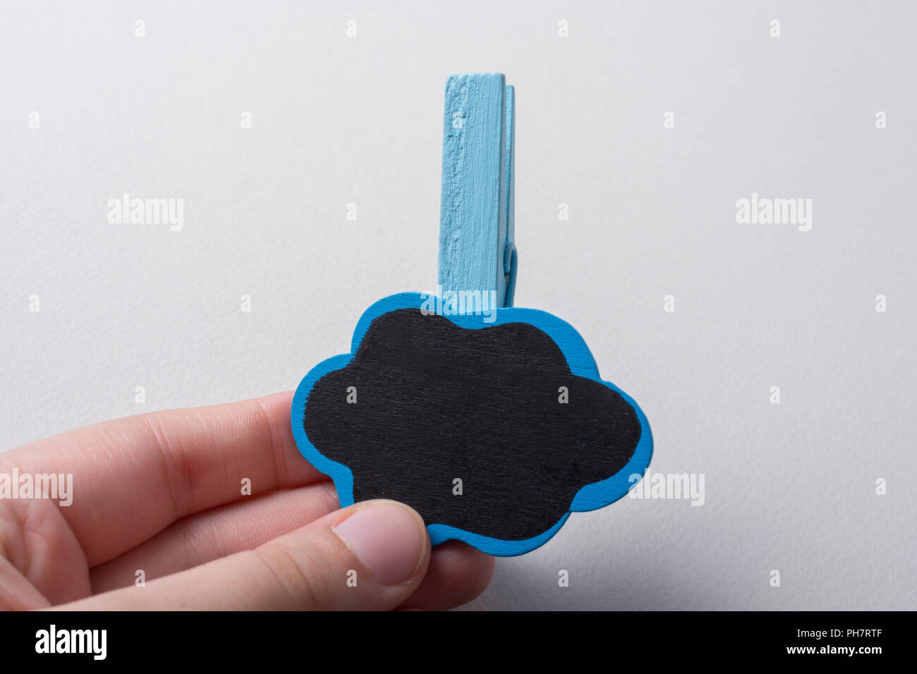 Mini speech bubble made of wood in hand Stock Photo - Alamy