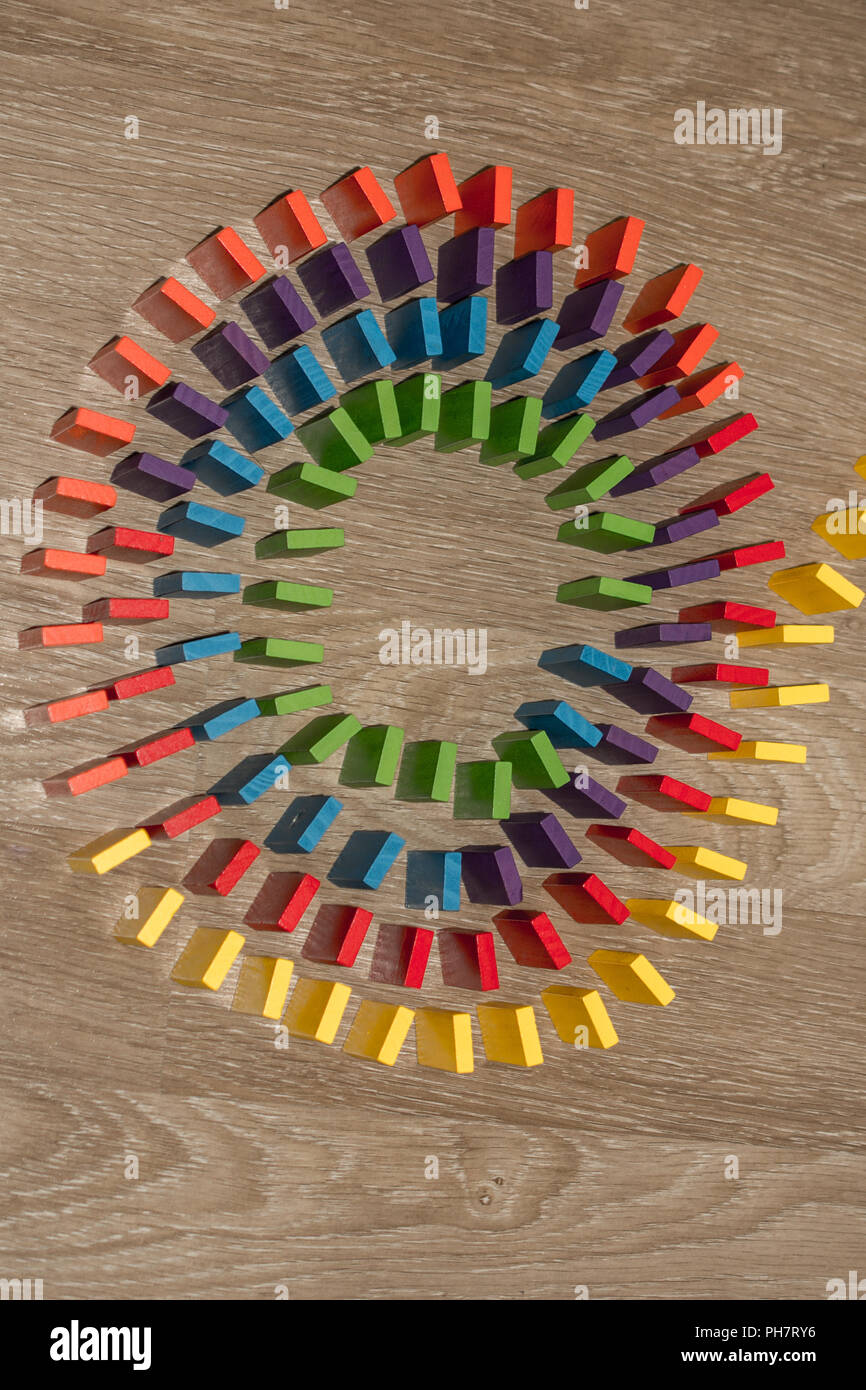 Colorful Domino Blocks in a line on a white background Stock Photo - Alamy