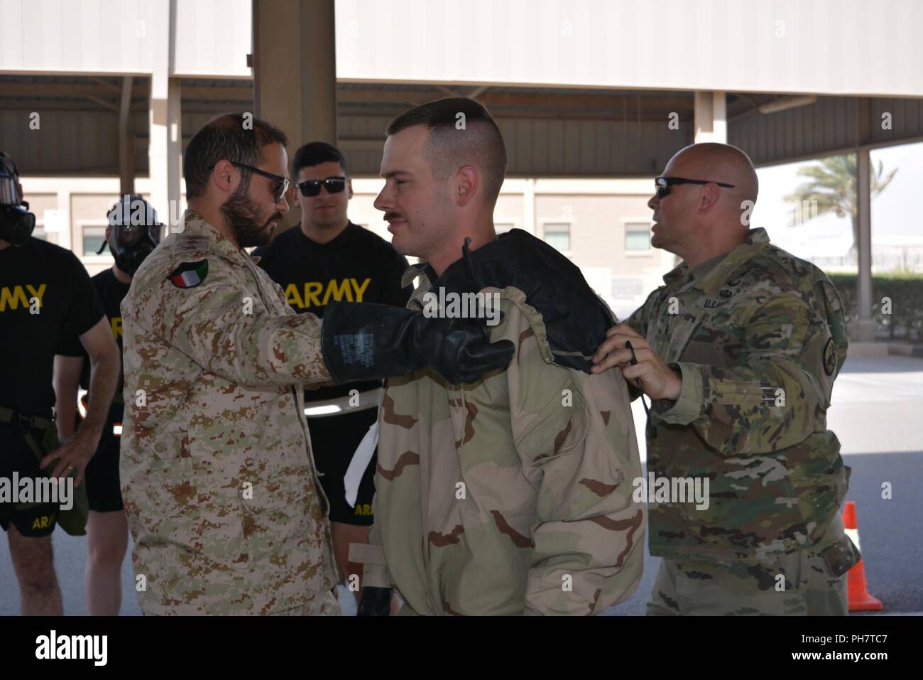 CAMP ARIFJAN, Kuwait – Capt. Abdul-Aziz Hamad Al-Muteri (left), with ...