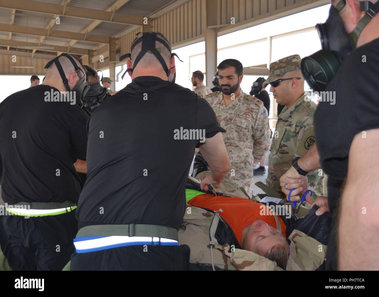 CAMP ARIFJAN, Kuwait – First Lt. Nawaf Tawfeeq Al-Awadi (center, facing ...