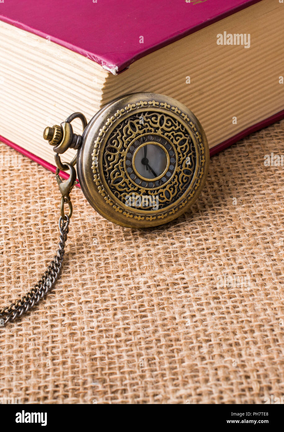 Pocket watch book stack hi-res stock photography and images - Alamy