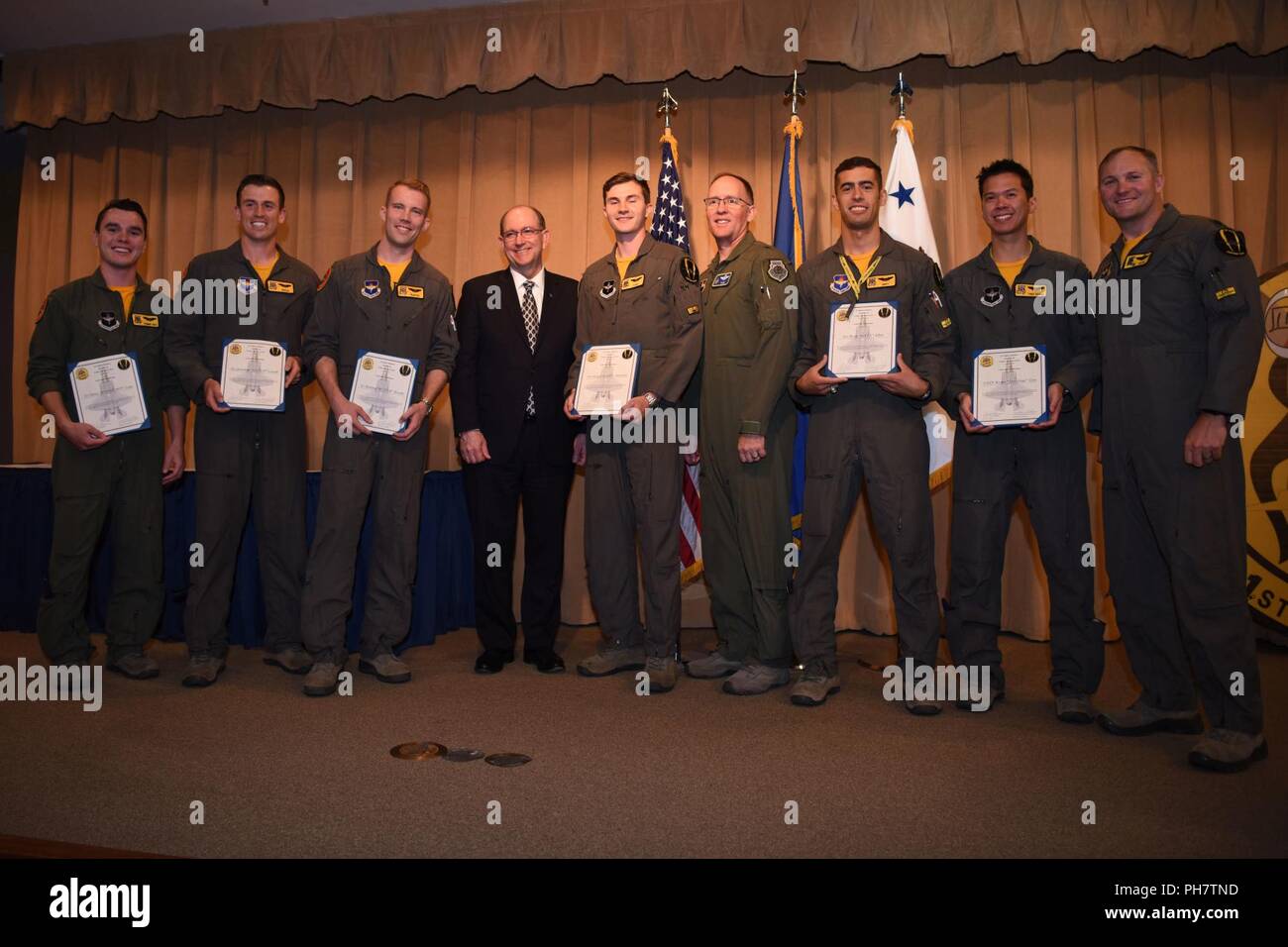 Under Secretary of the Air Force Matthew Donovan stands with the 61st ...