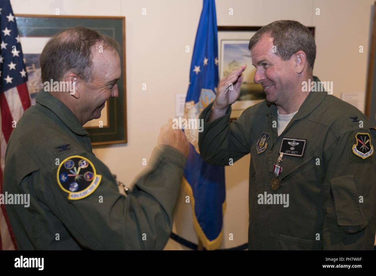 Col. Jeffrey Brett, right, salutes retired Col. Jerry Byars during a ...