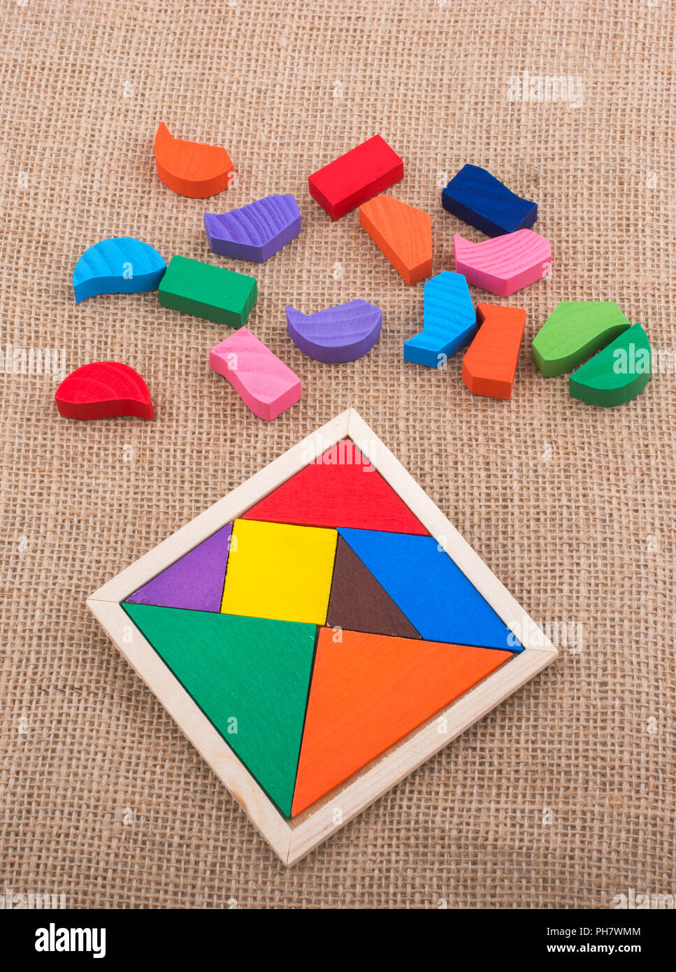Colorful pieces of a square tangram puzzle Stock Photo - Alamy