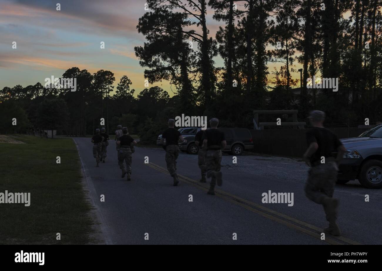 Junior ROTC cadets run an obstacle course during Summer Leadership ...