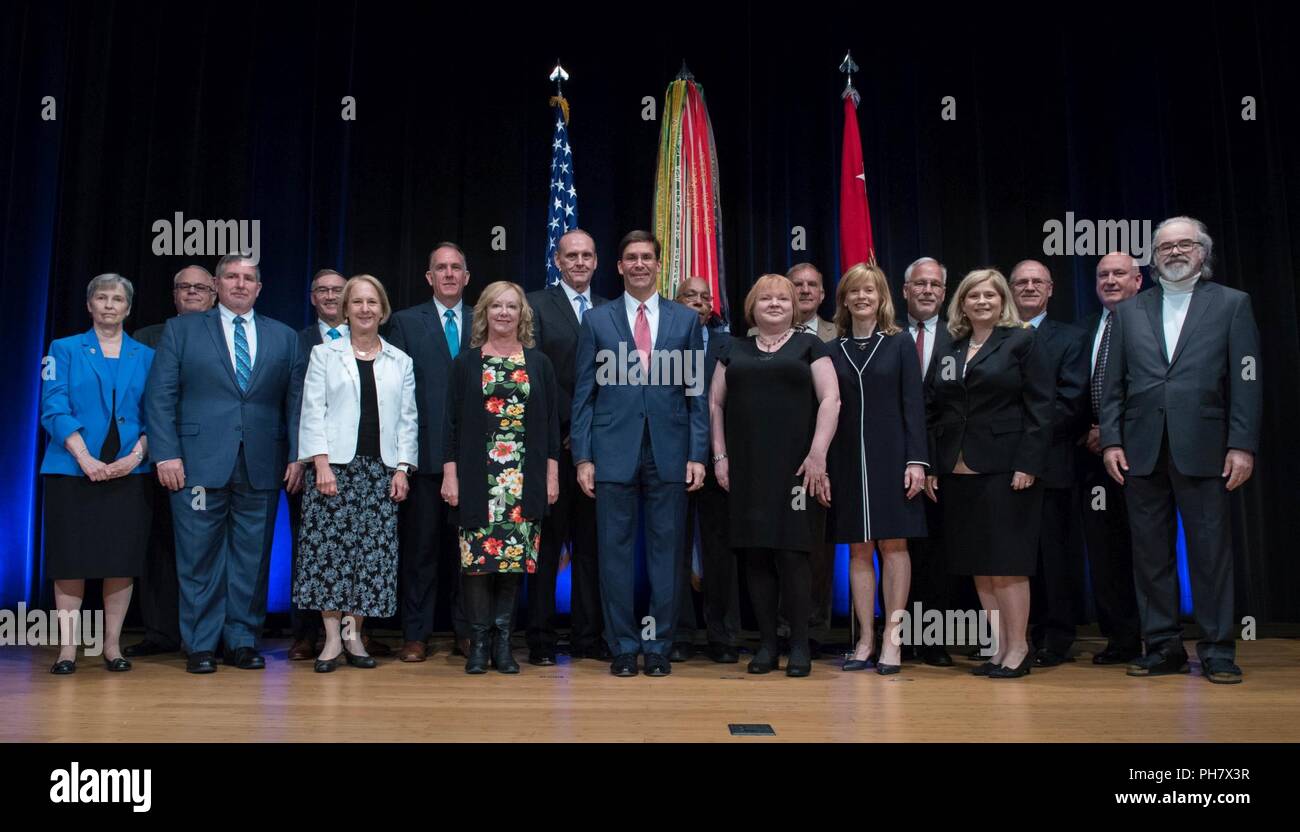 Secretary of the Army Dr. Mark Esper stands with recipients of the ...