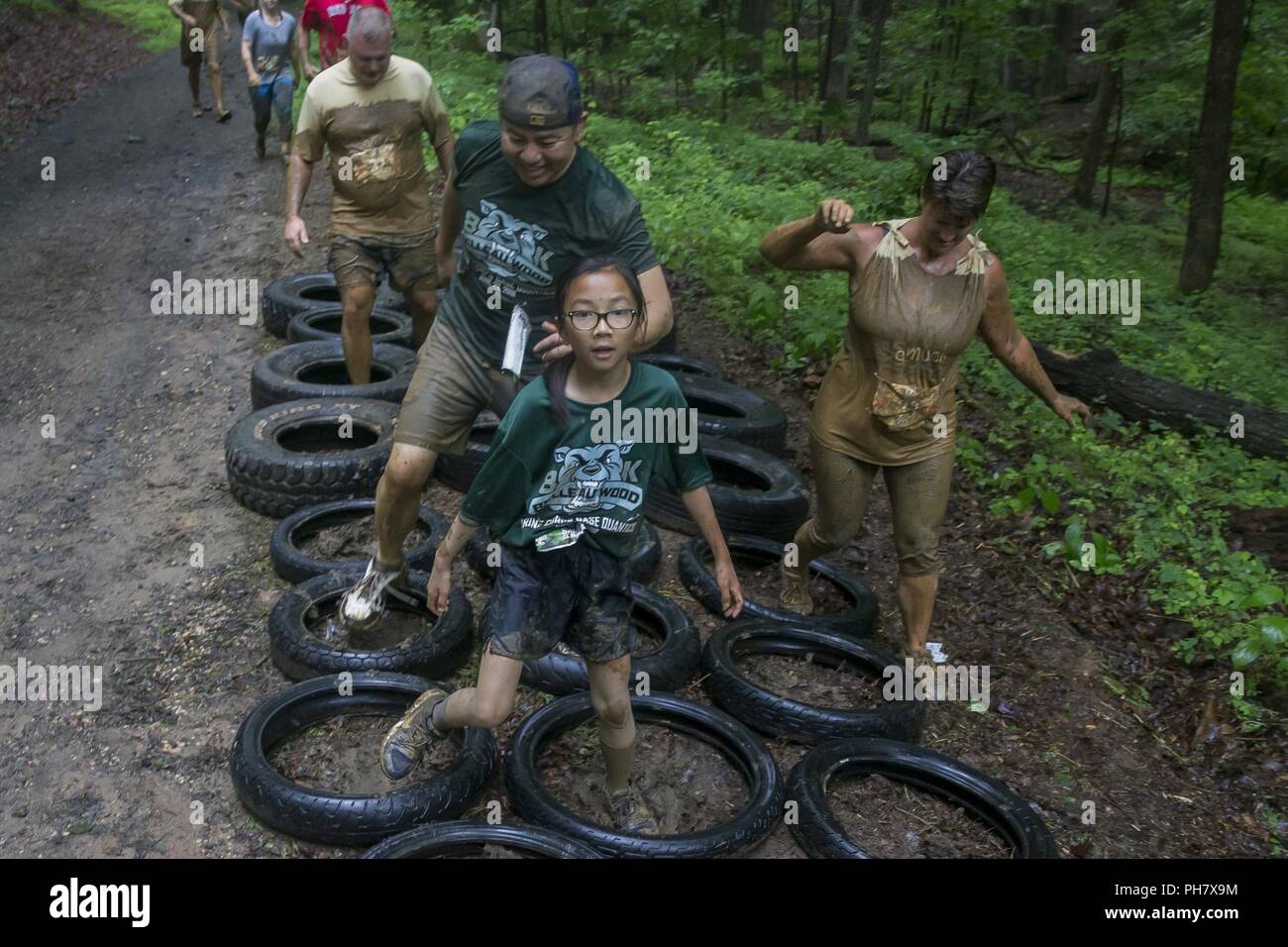 Participants navigate a tire obstacle during the annual Marine Corps ...