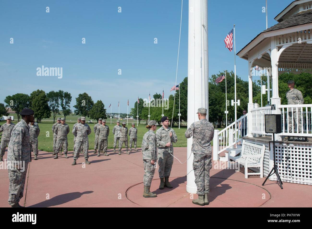 A flag detail prepares to lower the American flag as part of a Flag Day ...