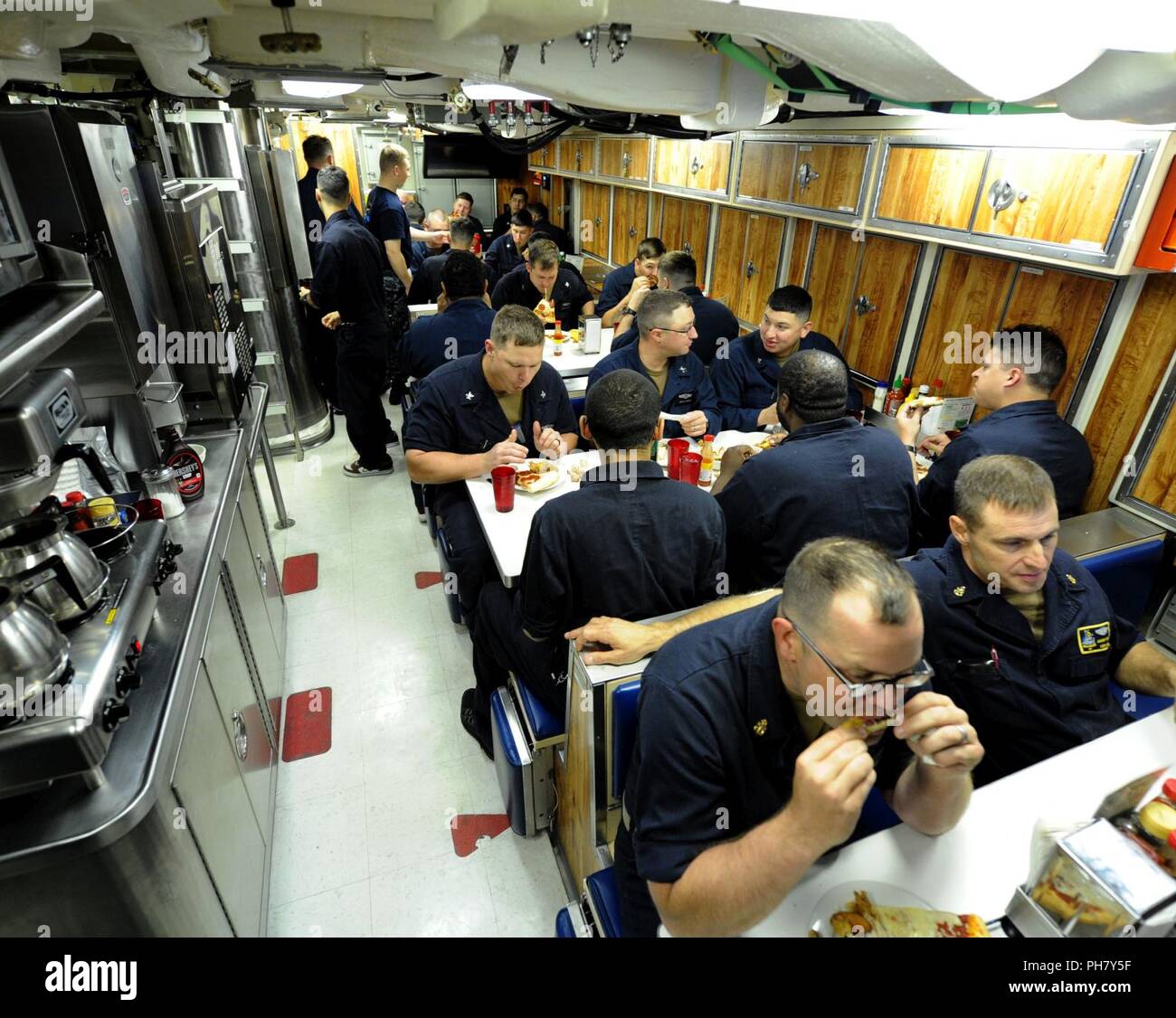 Sailors assigned to Pre-Commissioning Unit Indiana (SSN 789) eat dinner ...