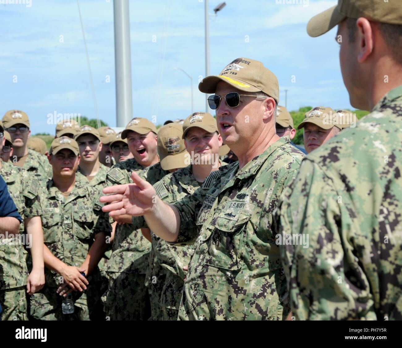 Cmdr. Jesse Zimbauer, center, commanding officer of Pre-Commissioning ...
