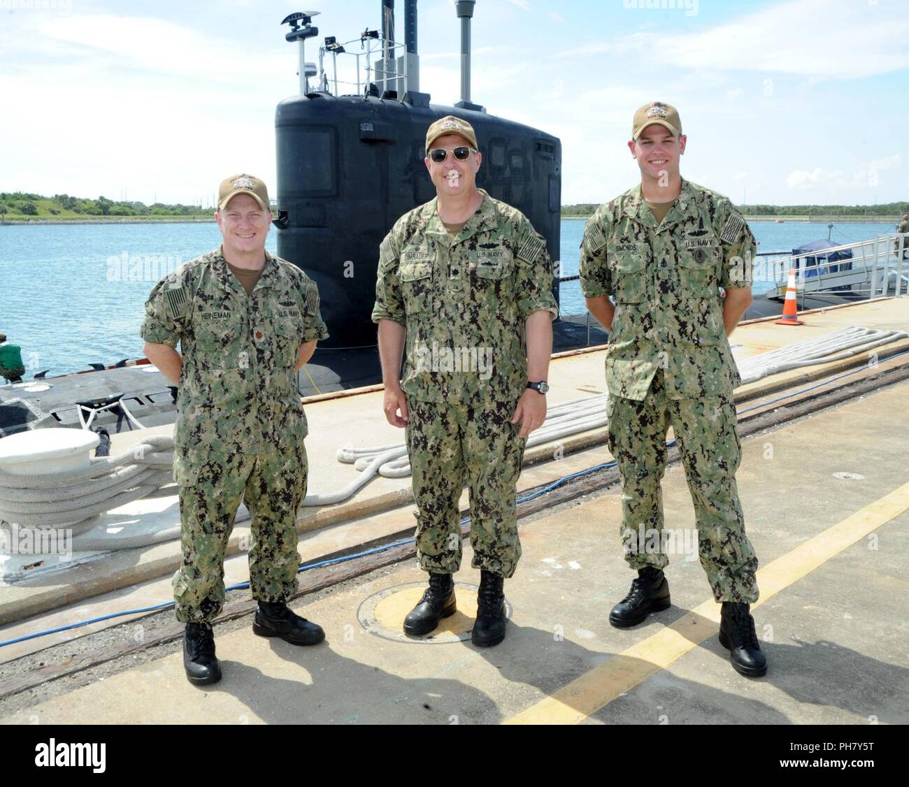 Executive Officer, Lt.Cmdr. Ryan Heineman, left, Commanding Officer ...