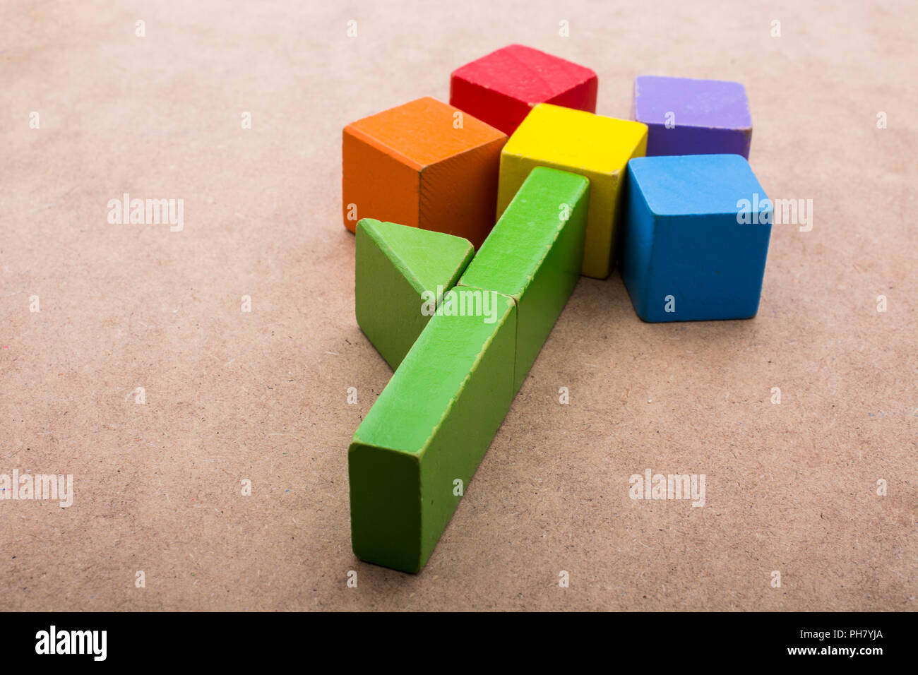 Colorful building blocks form a flower on a brown background Stock Photo - Alamy