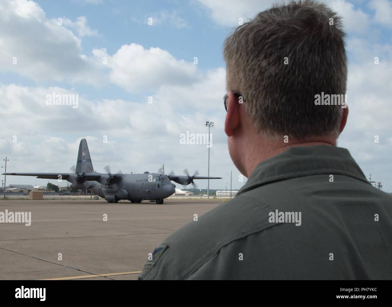 Col. David Compton, the 136th Operations Group Commander, looks on as ...