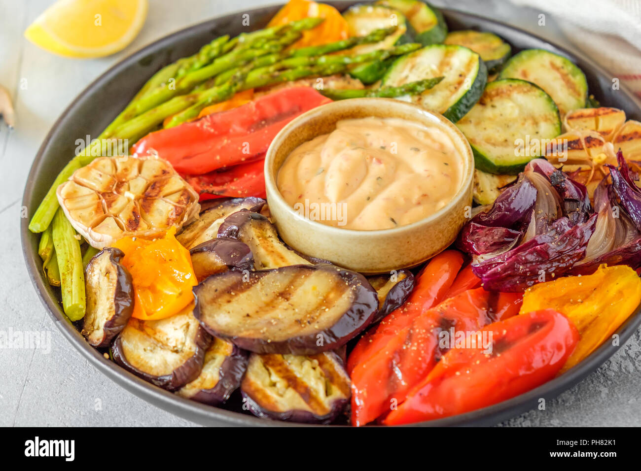 Grilled vegetables on a plate with sauce, selective focus Stock Photo ...