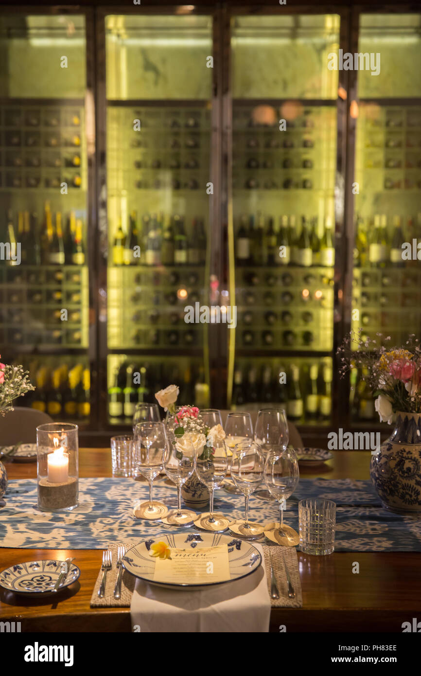 Wine bar tasting set up decoration. Many wine glasses and bottles in ...